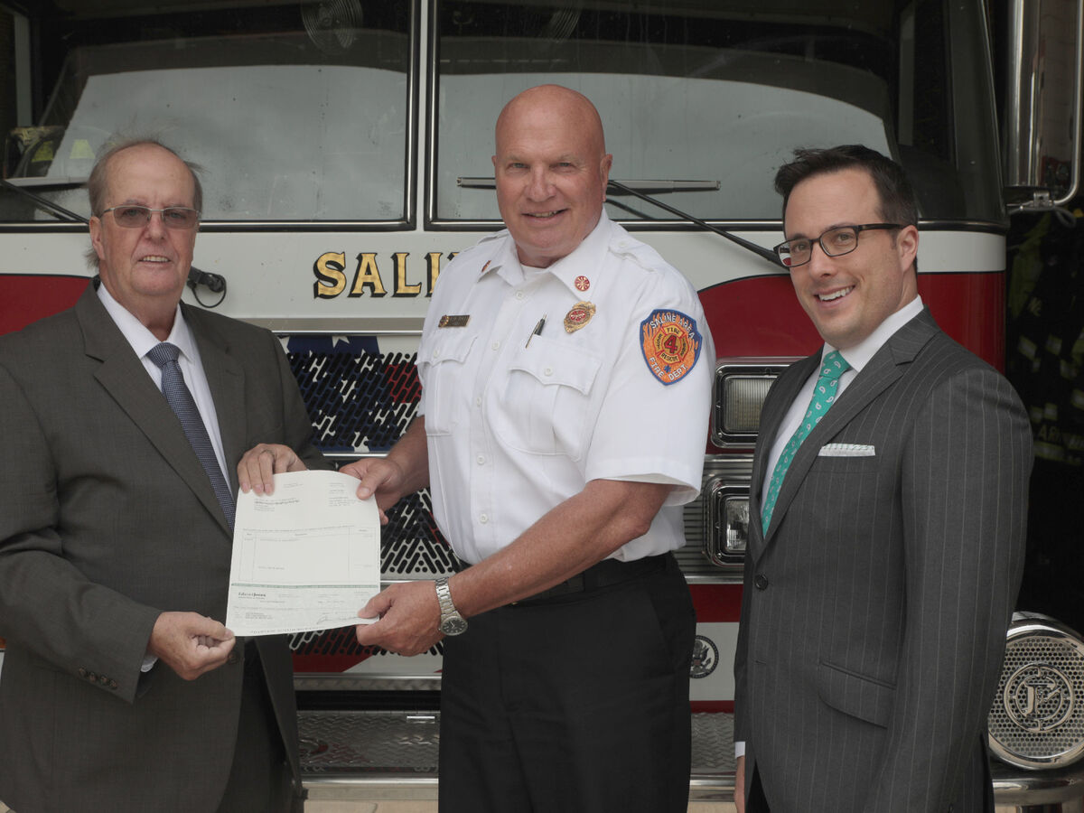 One Last Gift: Christmas in Action Donates to Saline Area Fire ...